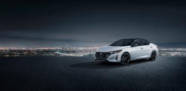 Front left 3/4 angle of a white Sentra Midnight Edition parked on a ...